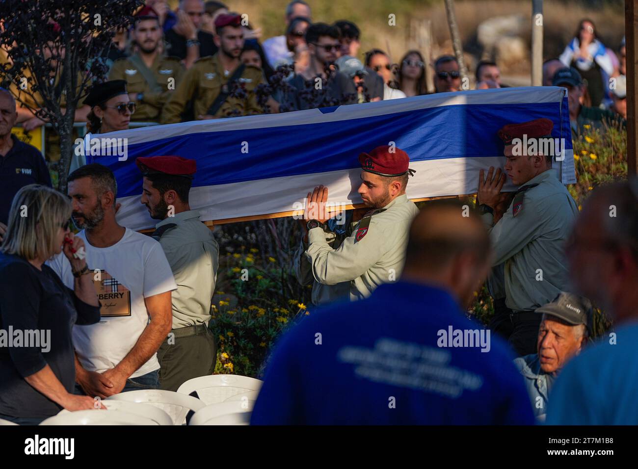 Israeli soldiers carry the flag-draped casket of Israeli soldier Capt ...