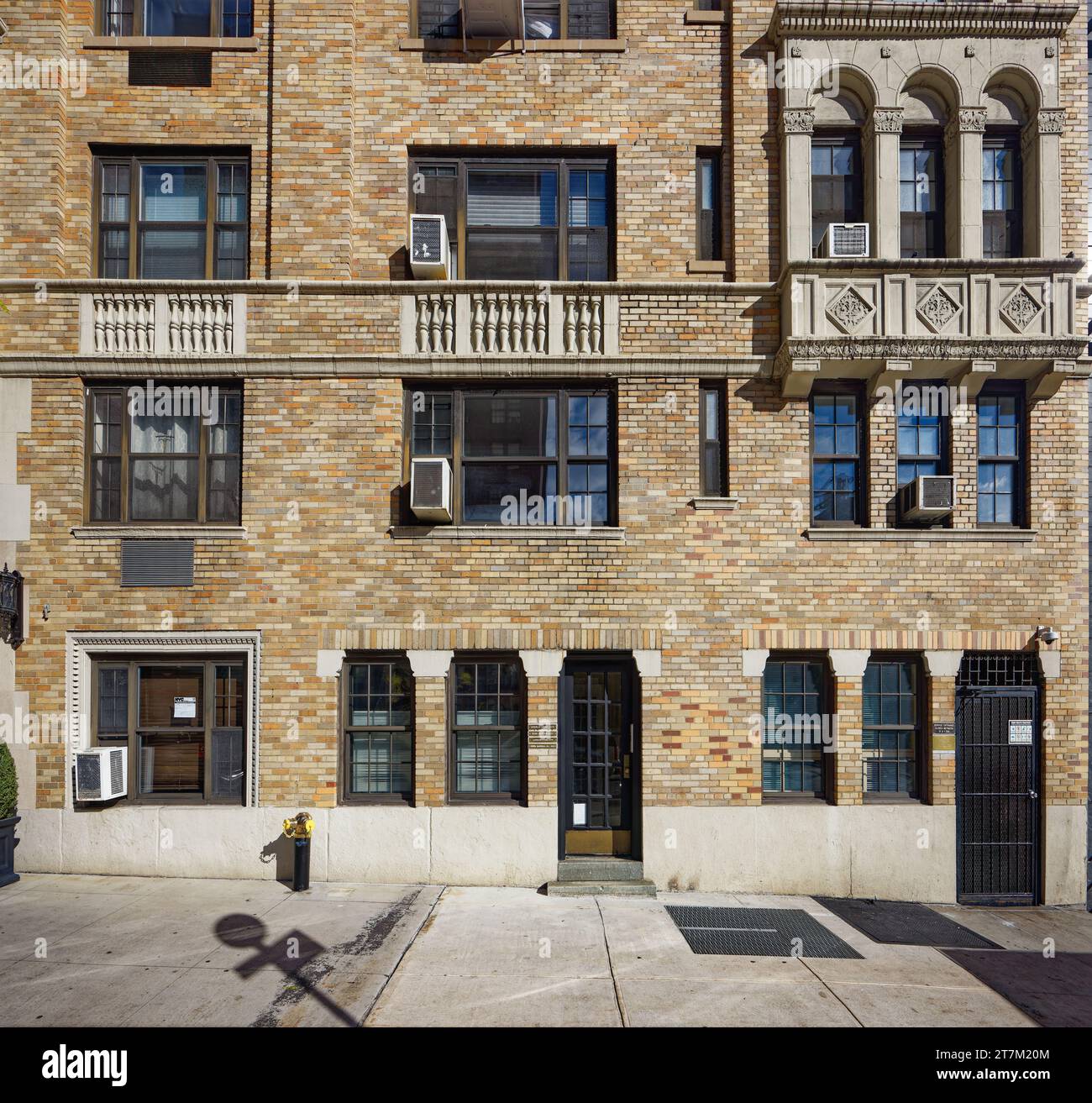 245 East 72nd Street, a brick and stone apartment building designed by ...