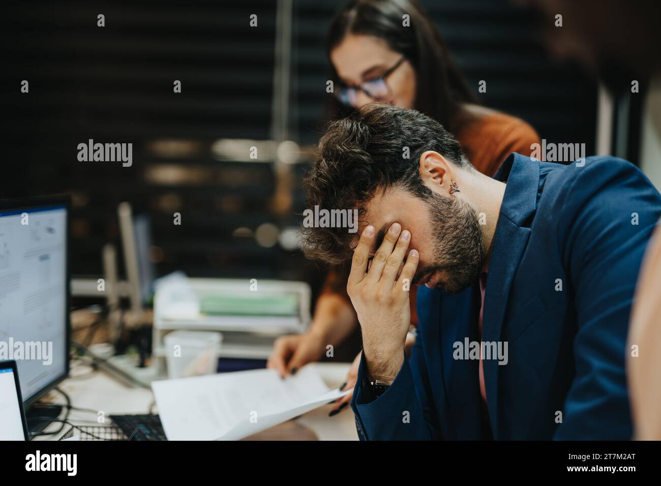 Disappointed male employee in disbelief before crying after he did ...