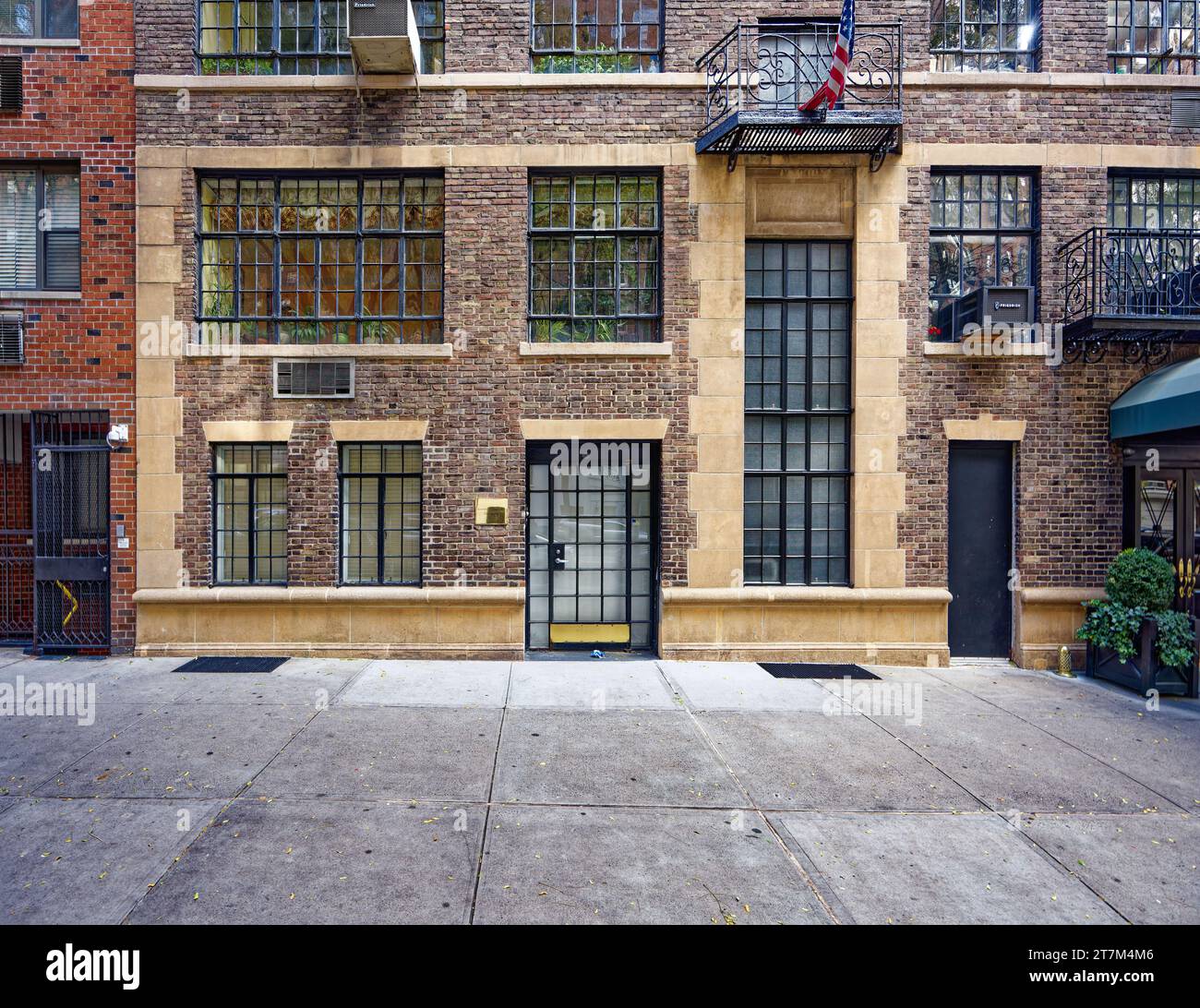 325 East 72nd Street, a brick and stone apartment building designed by ...