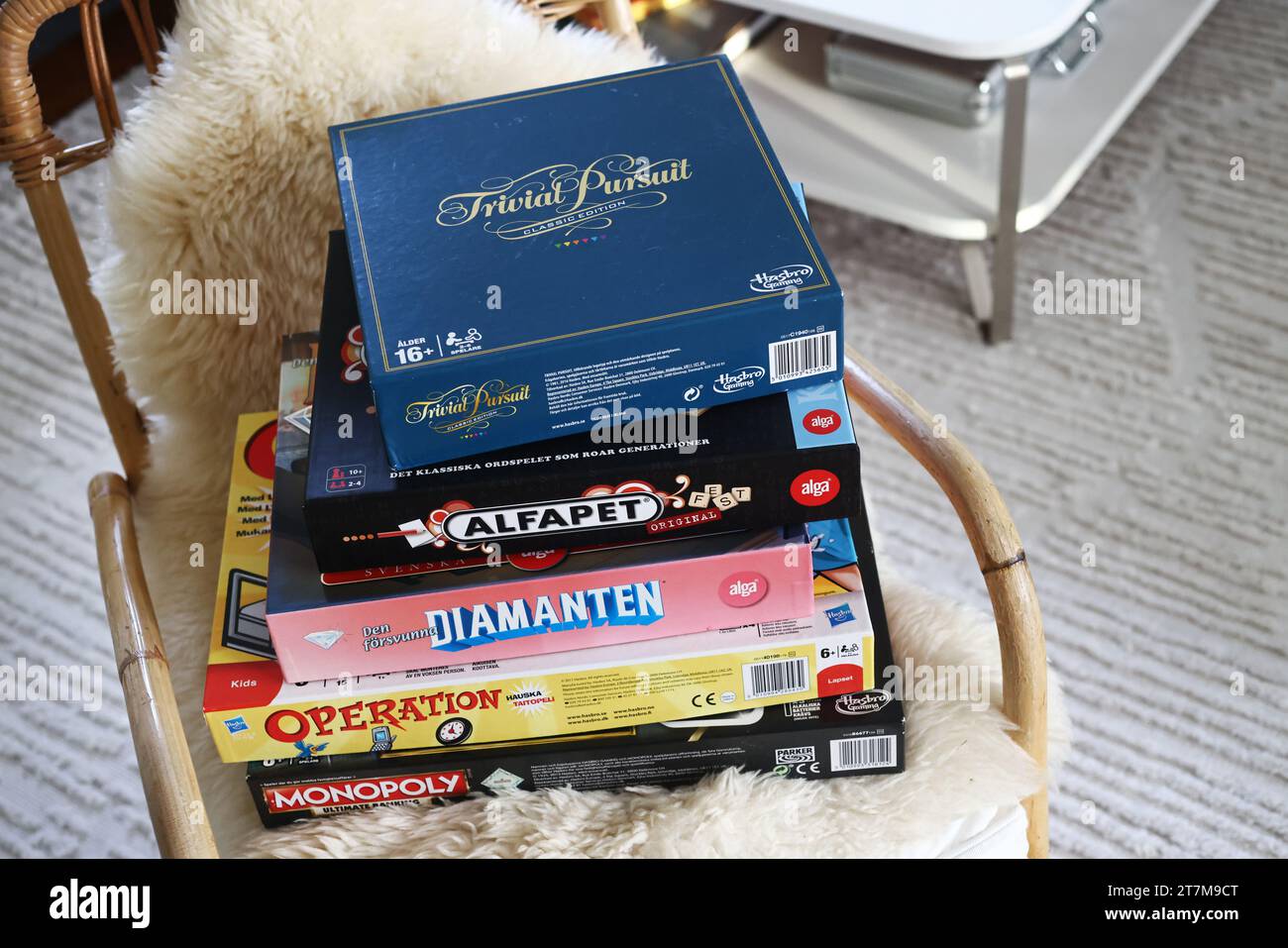 Board games (In swedish: sällskapsspel), in a swedish home Stock Photo ...