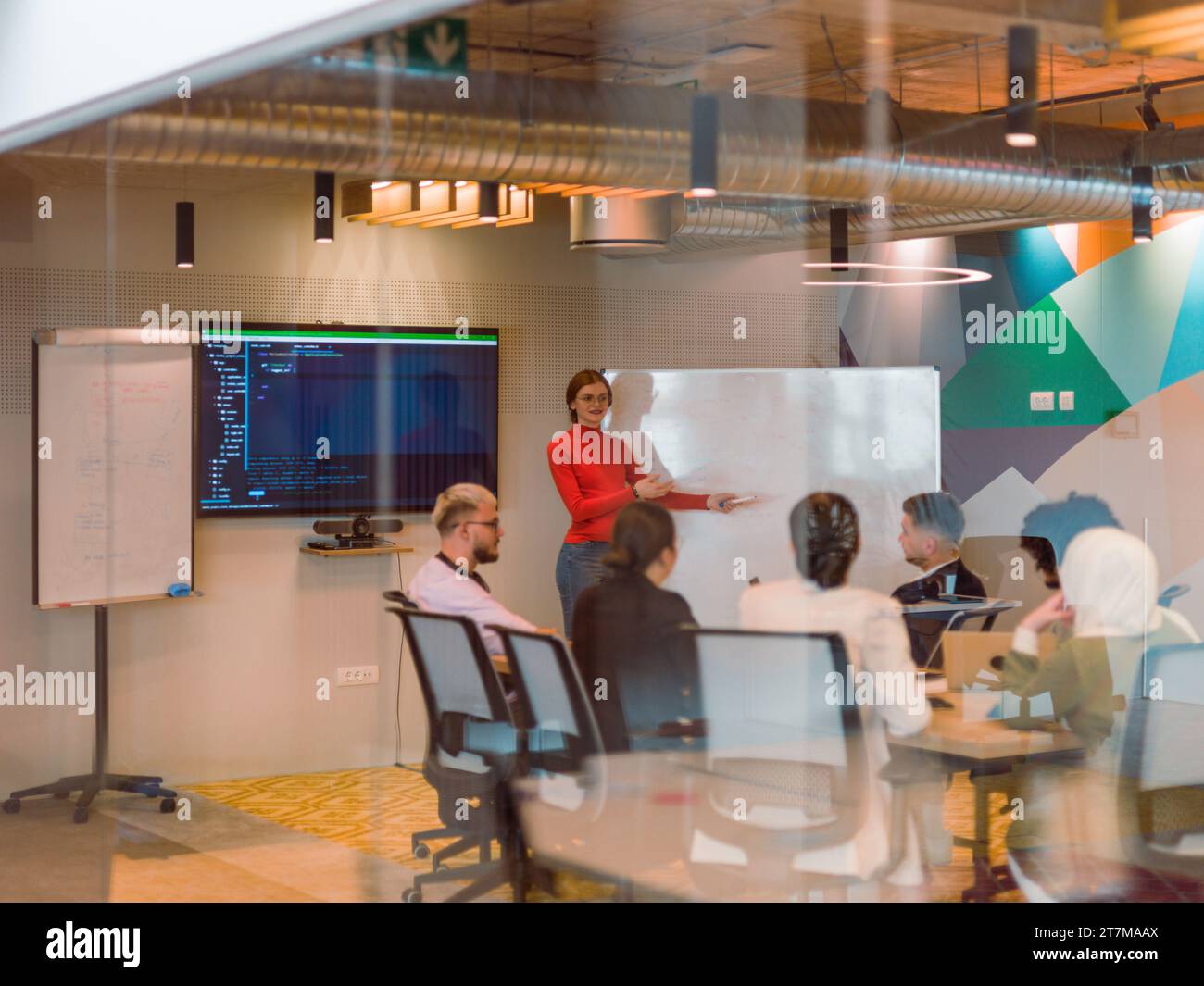 In the vibrant ambiance of a modern startup office, a diverse group of ...