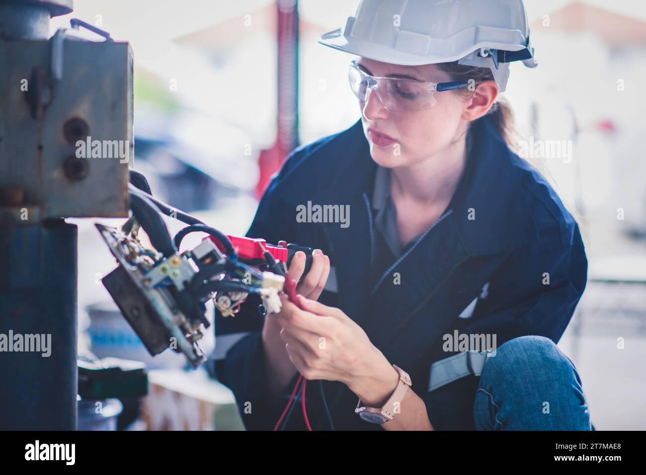 Electrical engineer work tester measuring voltage and current of power ...