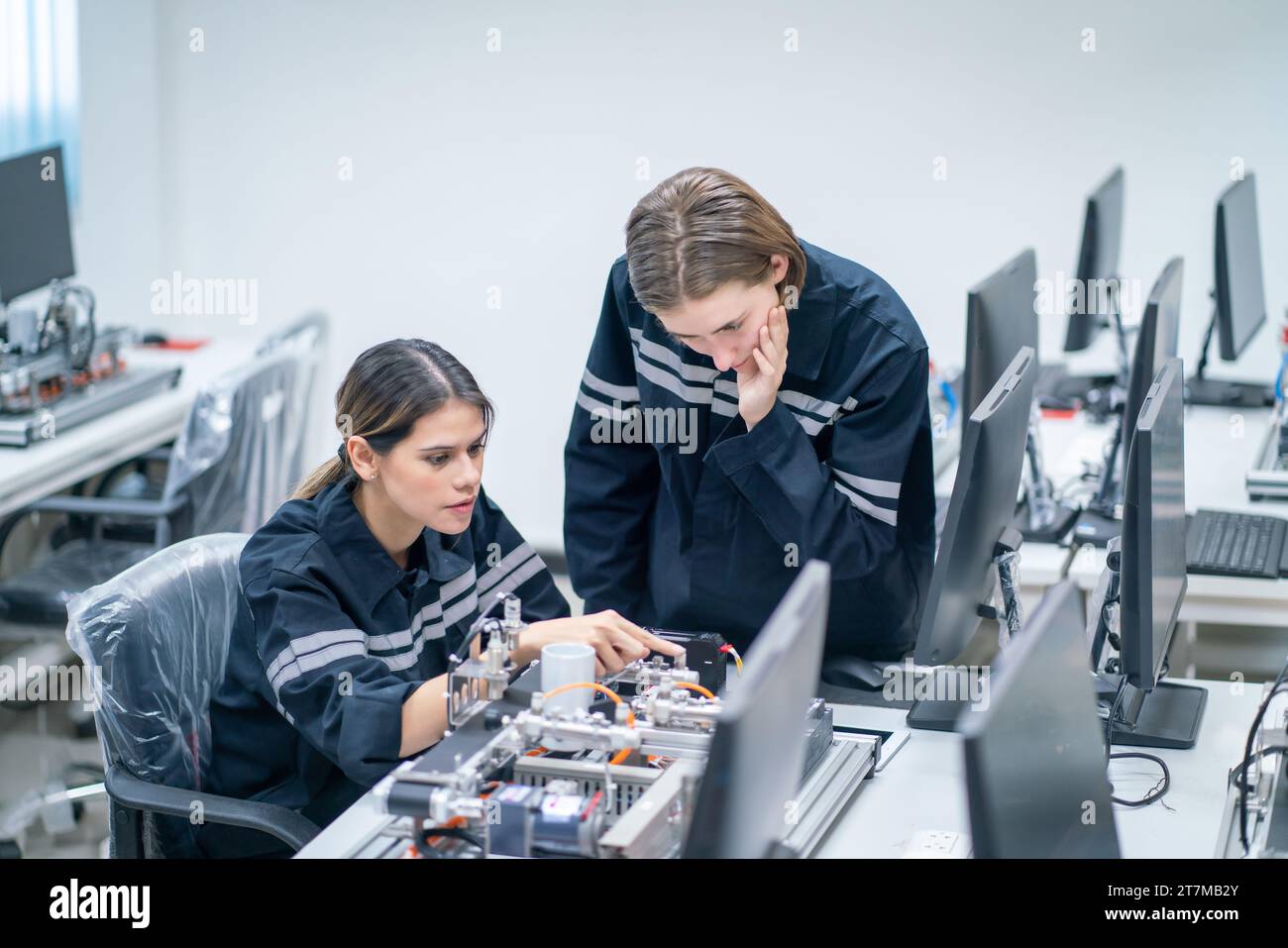 Mechanical engineering team working in robotic technology lap for ...