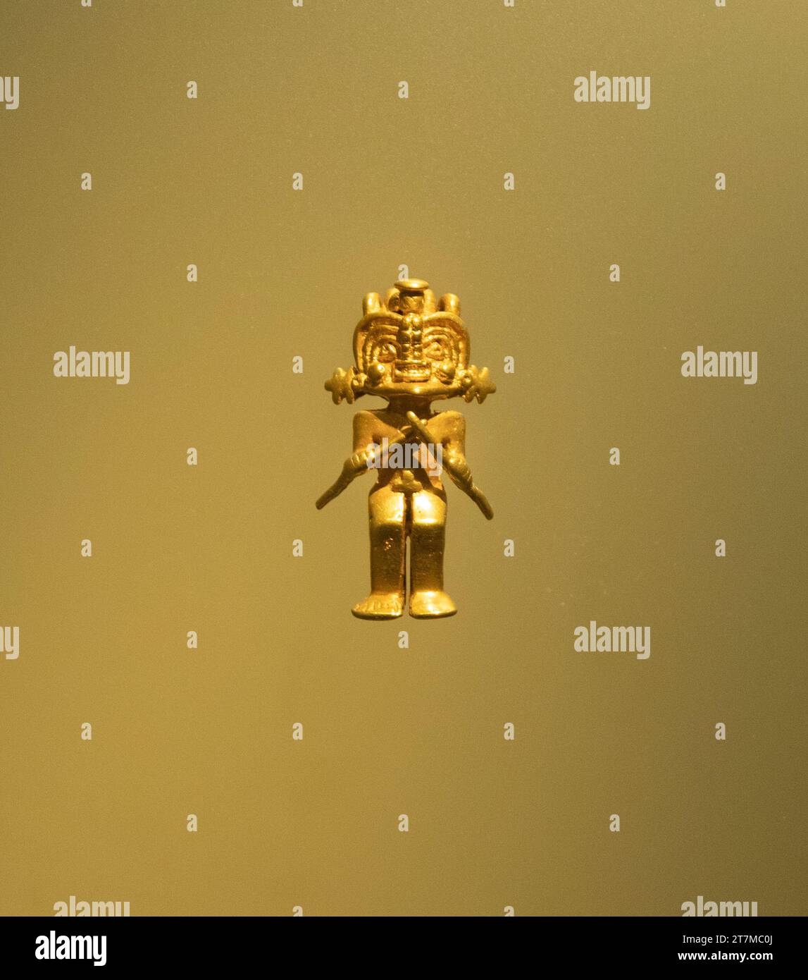 Anthropomorphic small golden figure of ancient indigenous at colombian ...