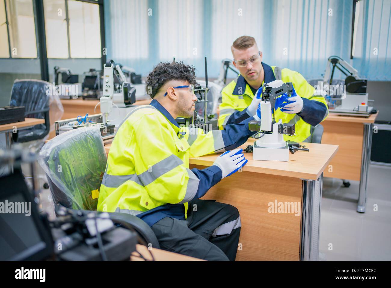 Mechanical engineering team working in robotic technology lap for ...