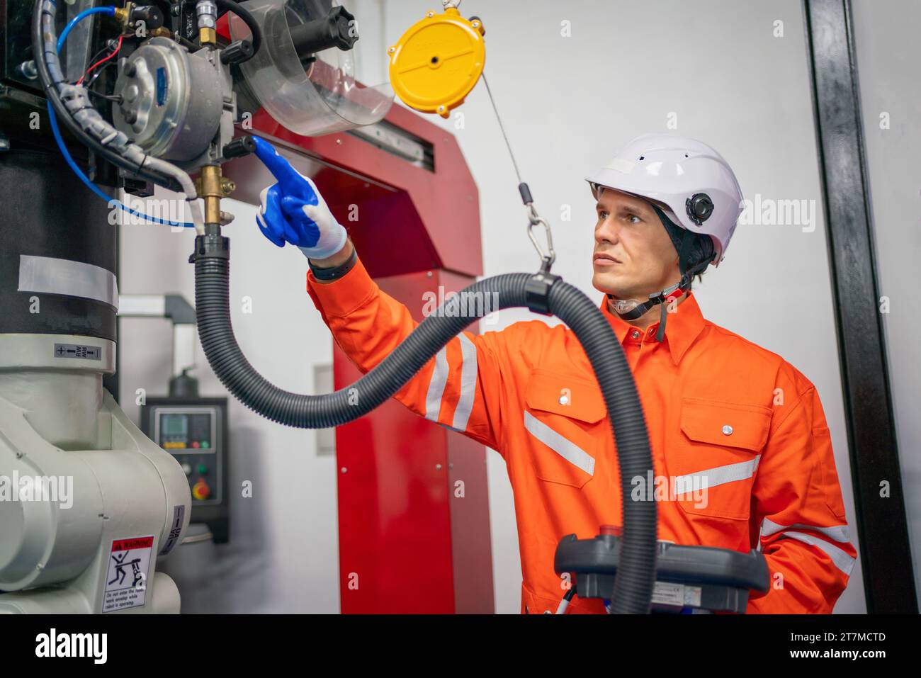 Engineers mechanic using computer controller Robotic arm for welding ...