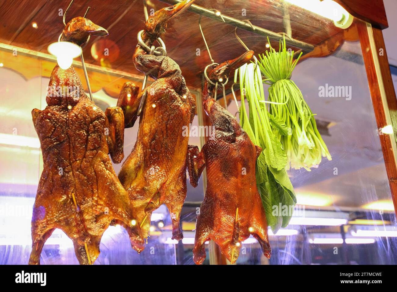 Roasted ducks, Peking duck are displayed in restaurant windows of ...