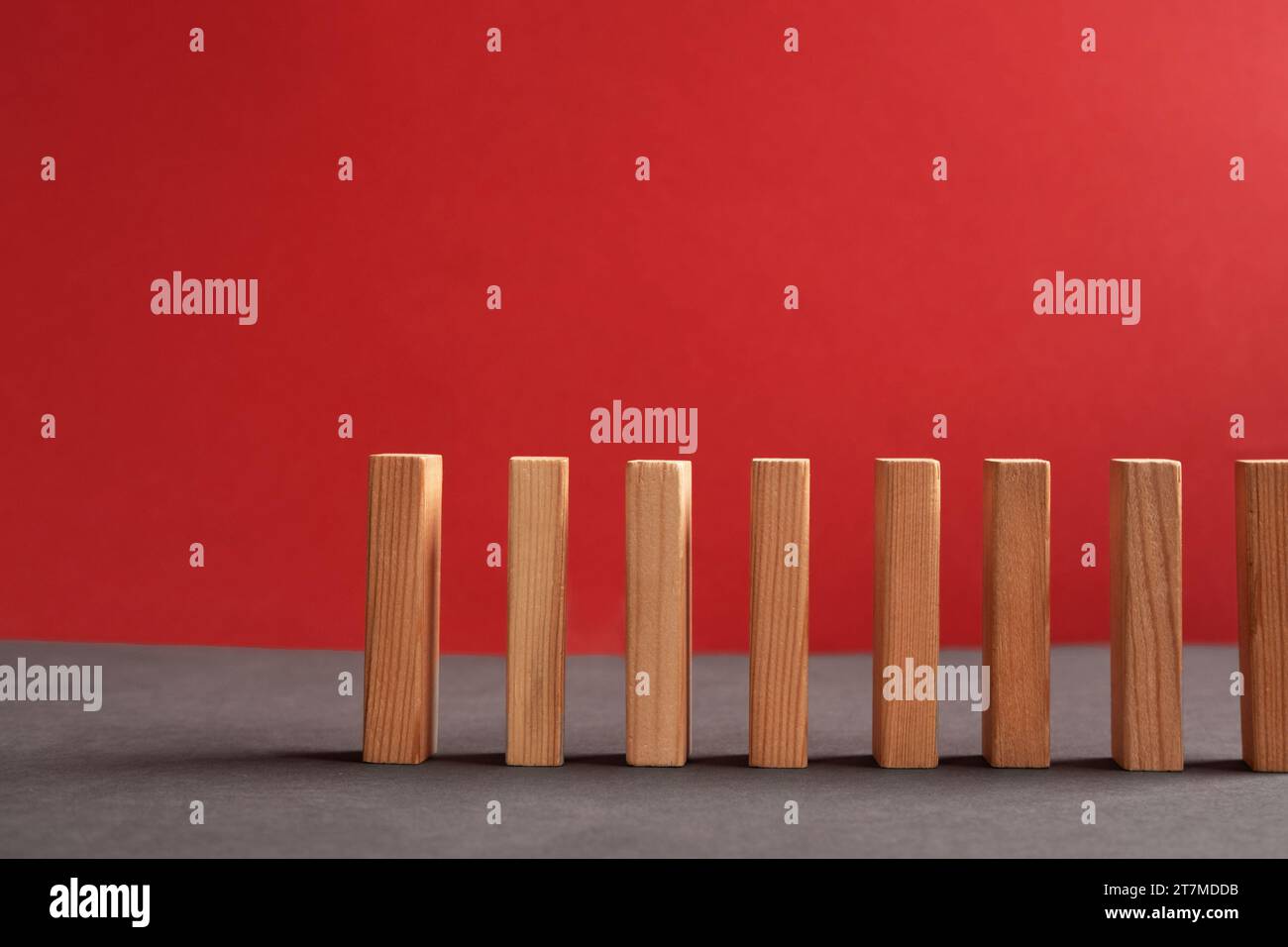 Domino has Fallen in a Row. Domino theory. Effect. Hand with Finger is ...