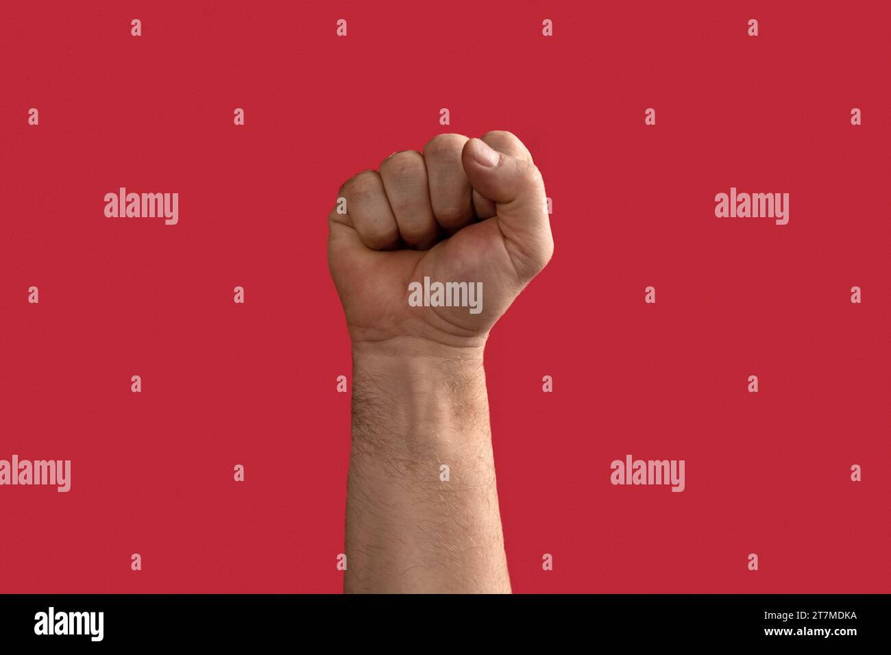 Black and White Man Hand with Raised Fist isolated on Red Background ...