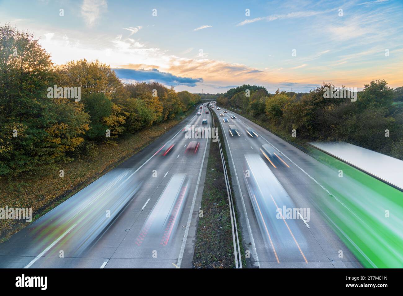 Fast moving cars on UK Motorway at sunset. Concept of busy roads and ...