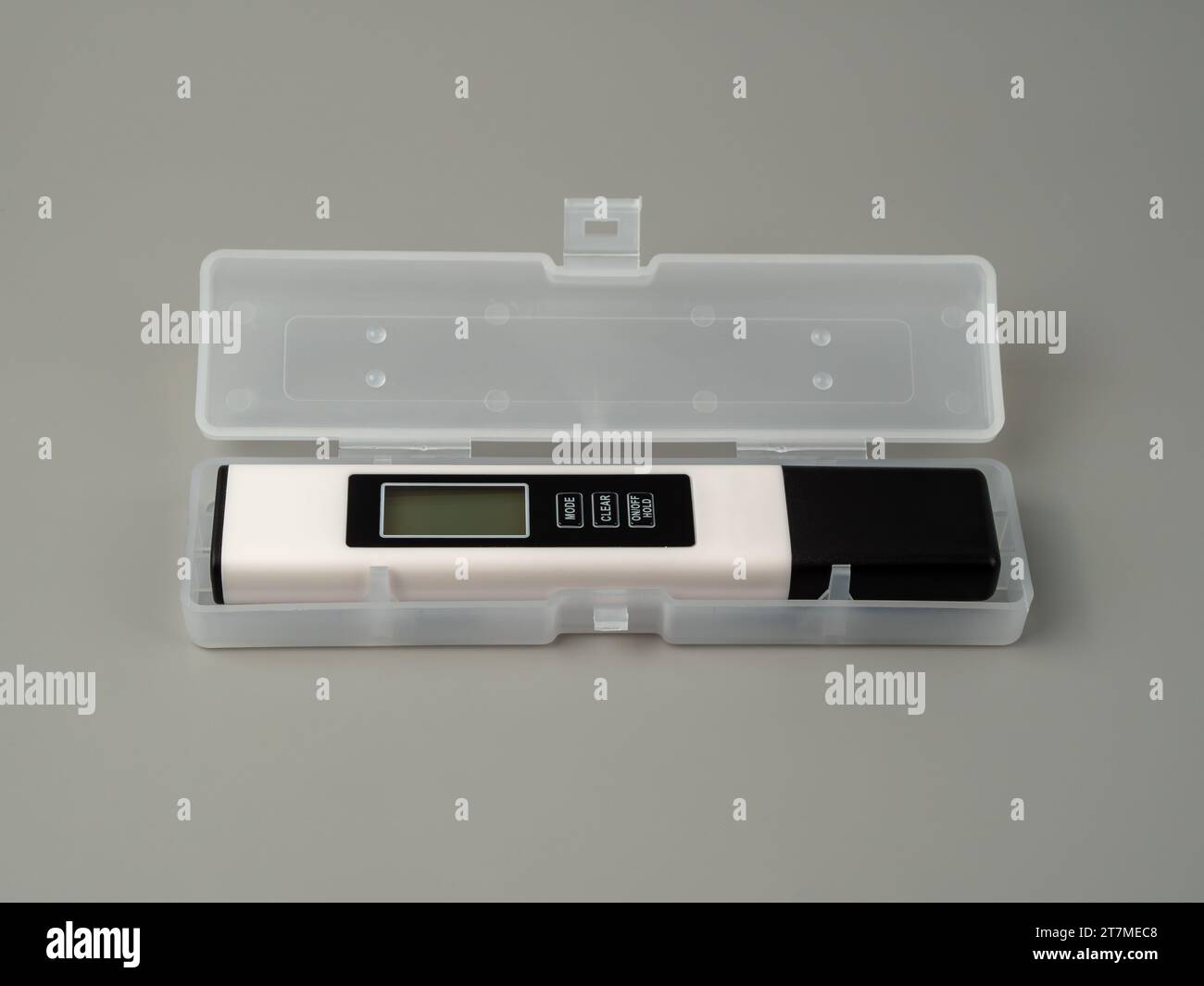 Water quality tester on a gray background. Device for measuring water ...