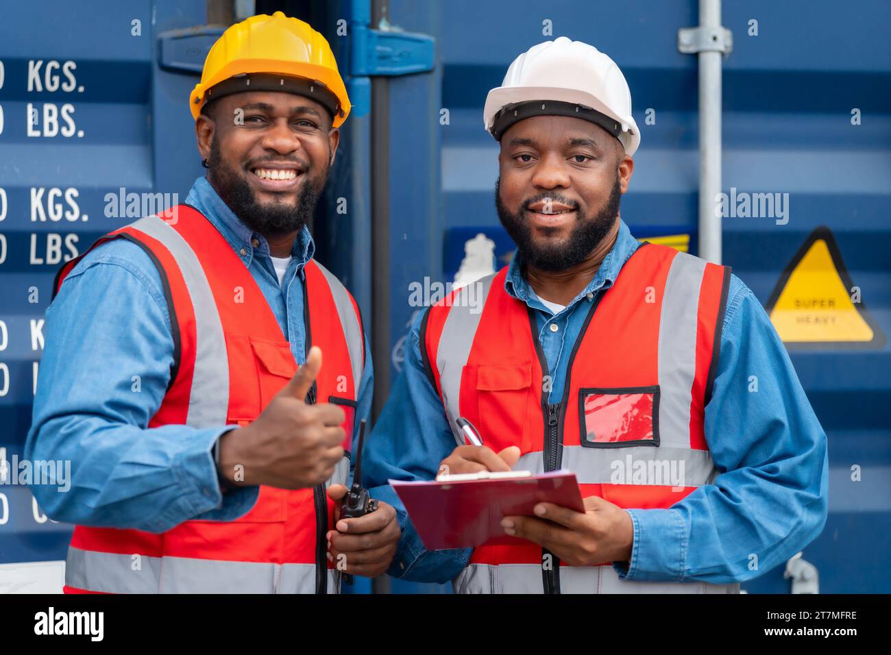 Portrait of Two African Engineer or foreman wears PPE checking ...