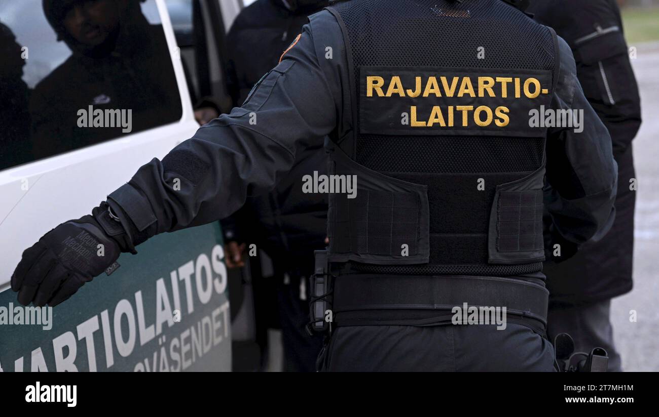 Migrants arriving from Russia board a van to be transported to the ...