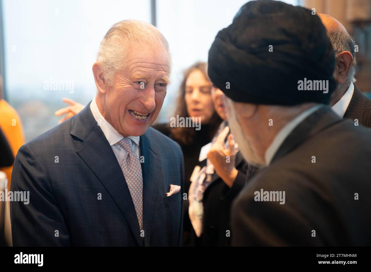 King Charles III speaks with faith leaders at a reception of faith ...