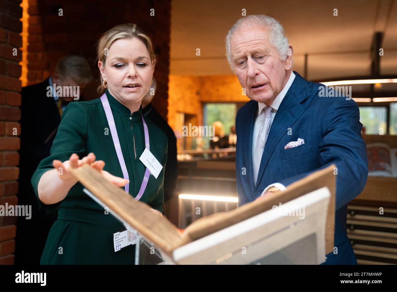 King Charles III looks at religious books during a reception of faith ...