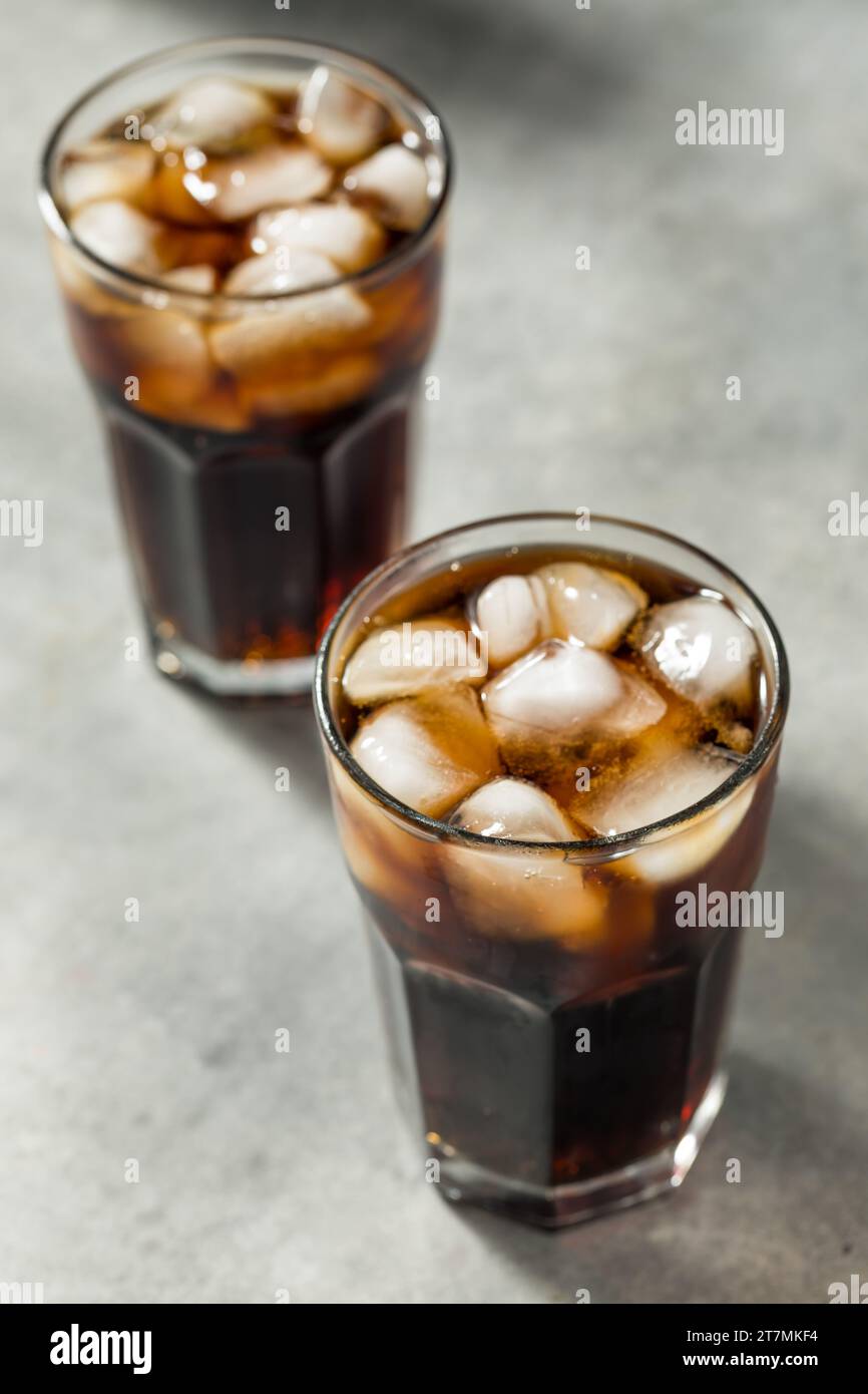 Cold Refreshing Dark Brown Cola with Ice Cubes Stock Photo - Alamy