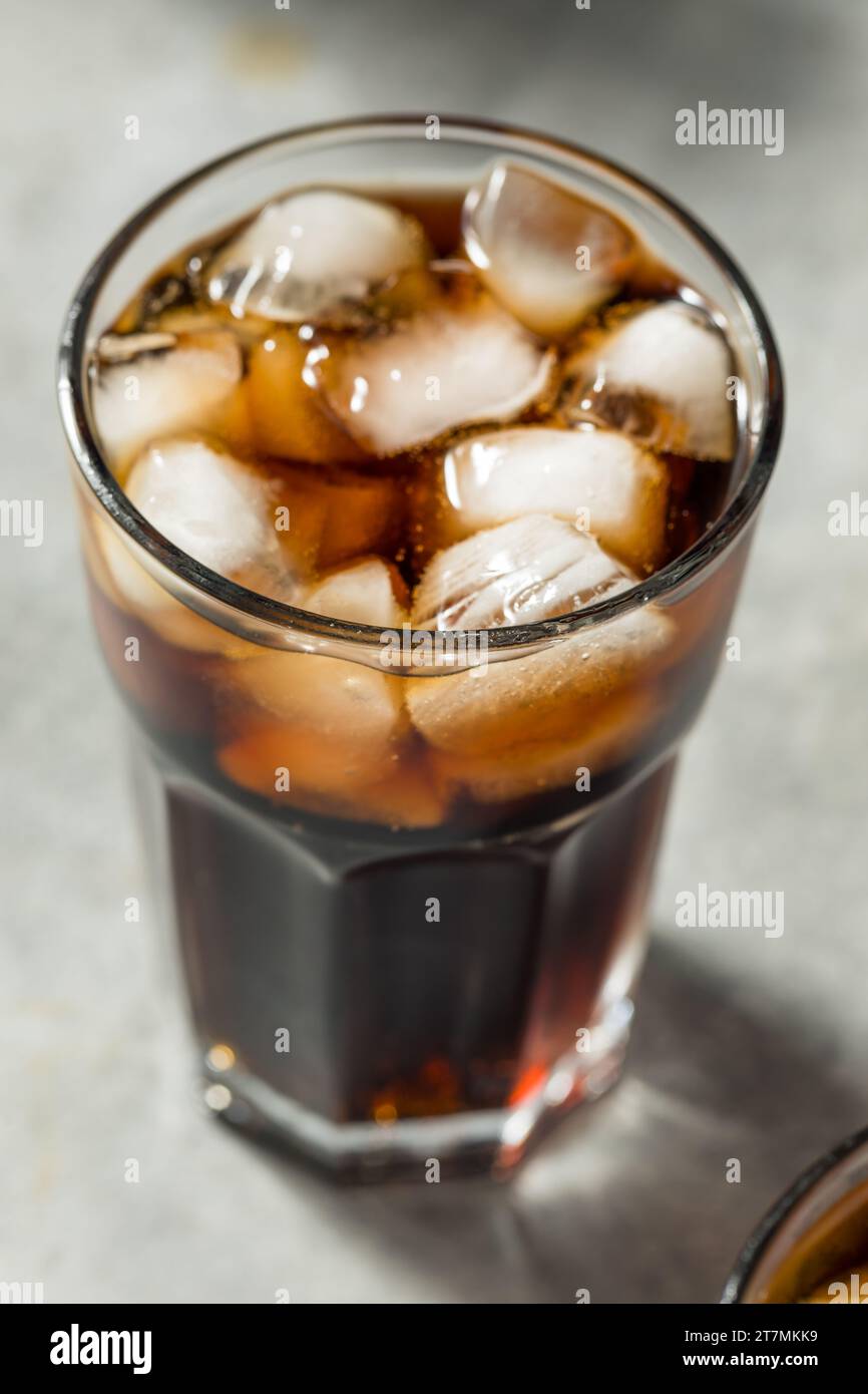 Cold Refreshing Dark Brown Cola with Ice Cubes Stock Photo - Alamy