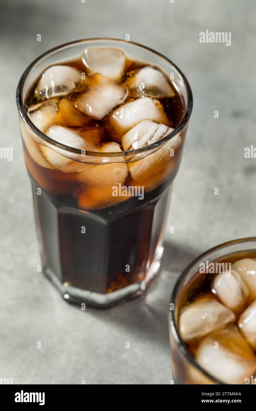 Cold Refreshing Dark Brown Cola with Ice Cubes Stock Photo - Alamy