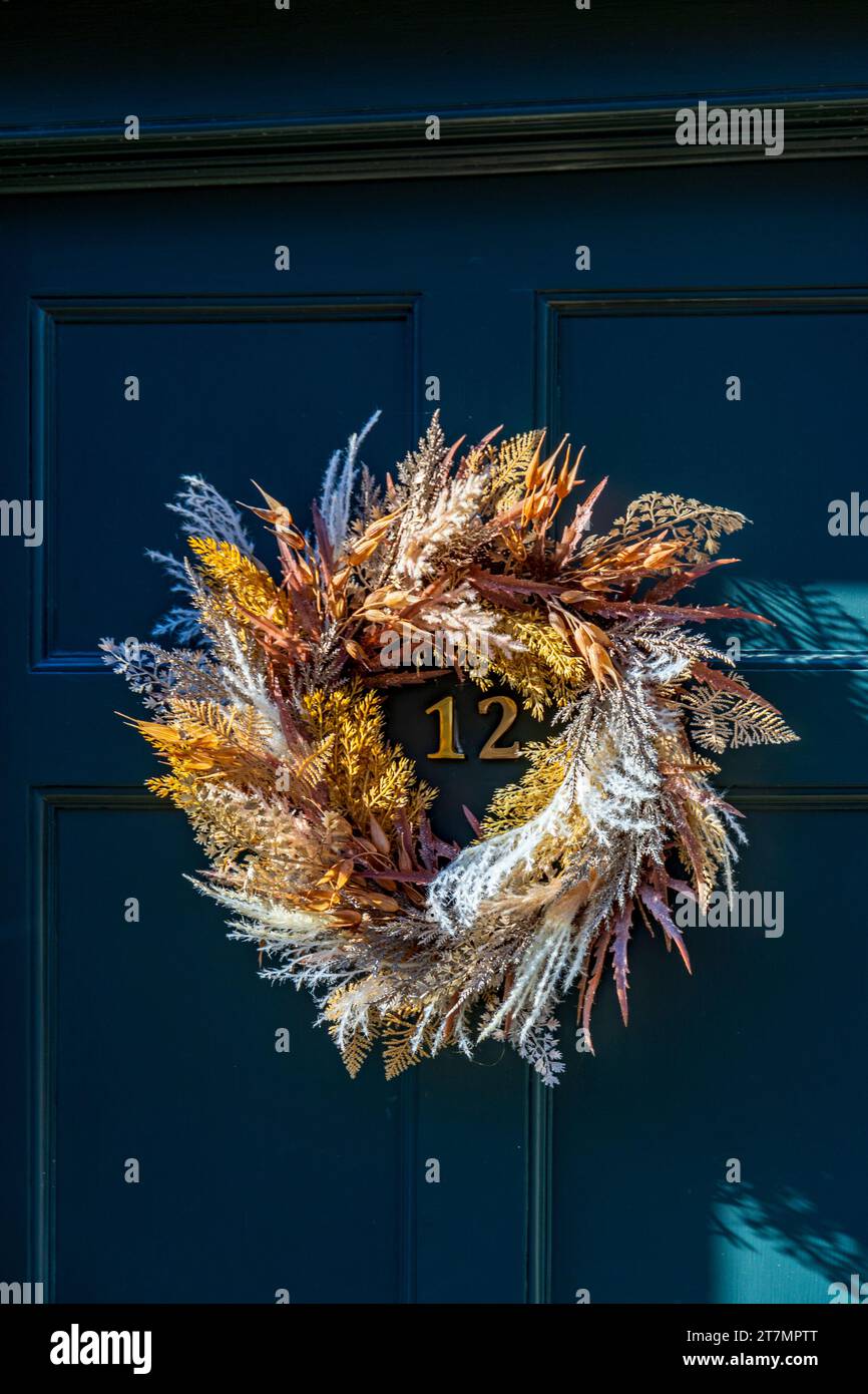 An attractive and artistic wreath in autumnal colours on a door in East ...