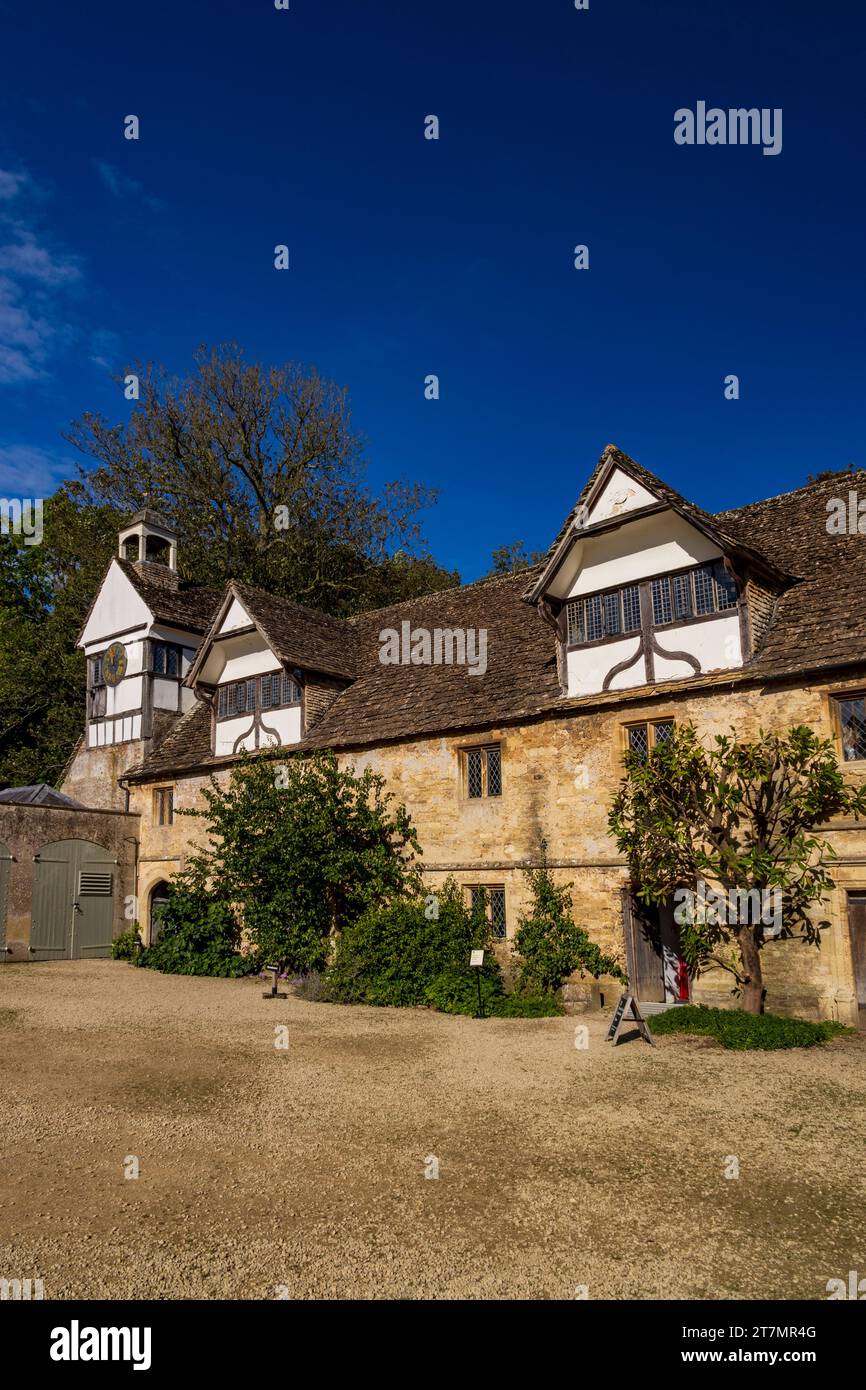 The tudor-style architecture of the courtyard and clock tower at Lacock ...