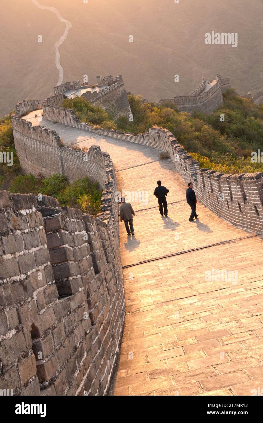 Three men walking on Great Wall of China at Huanghua Cheng (Yellow ...