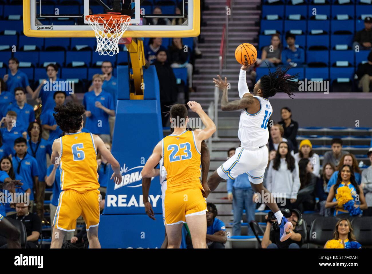 UCLA Bruins guard Sebastian Mack (12) scores against LIU Sharks forward ...