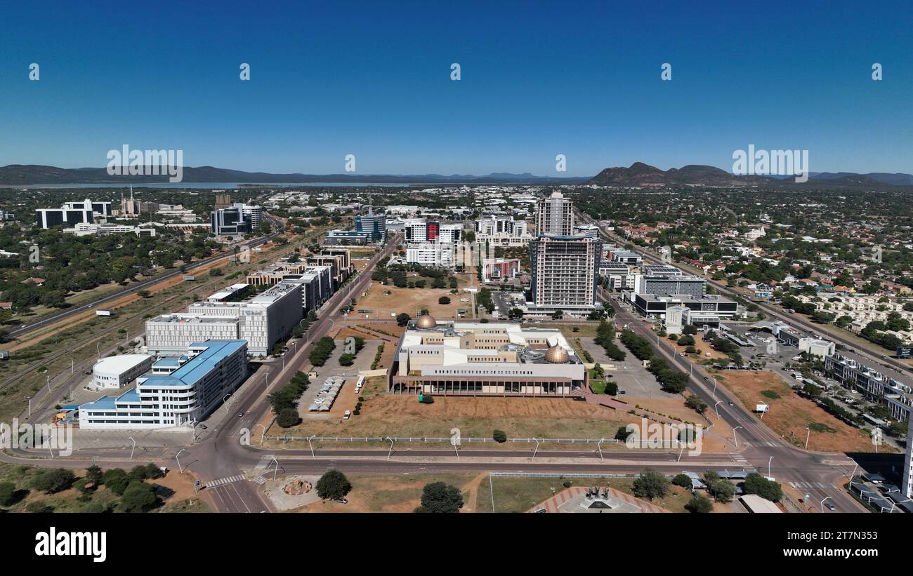 Aerial view of city skyline featuring tall skyscrapers and empty streets of Gaborone, Botswana ...