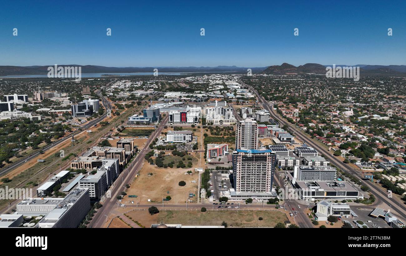 An aerial view of a vibrant city, with numerous skyscrapers and ...