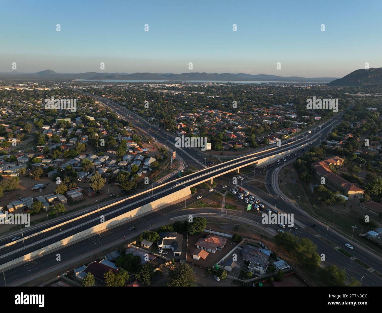 Aerial view of a bustling cityscape featuring a major interstate ...