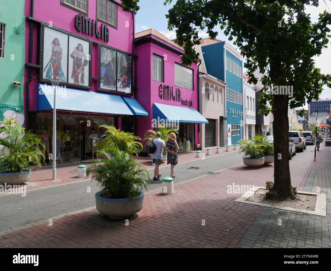People shopping on a colourful street in the capital of Curacao, Dutch ...