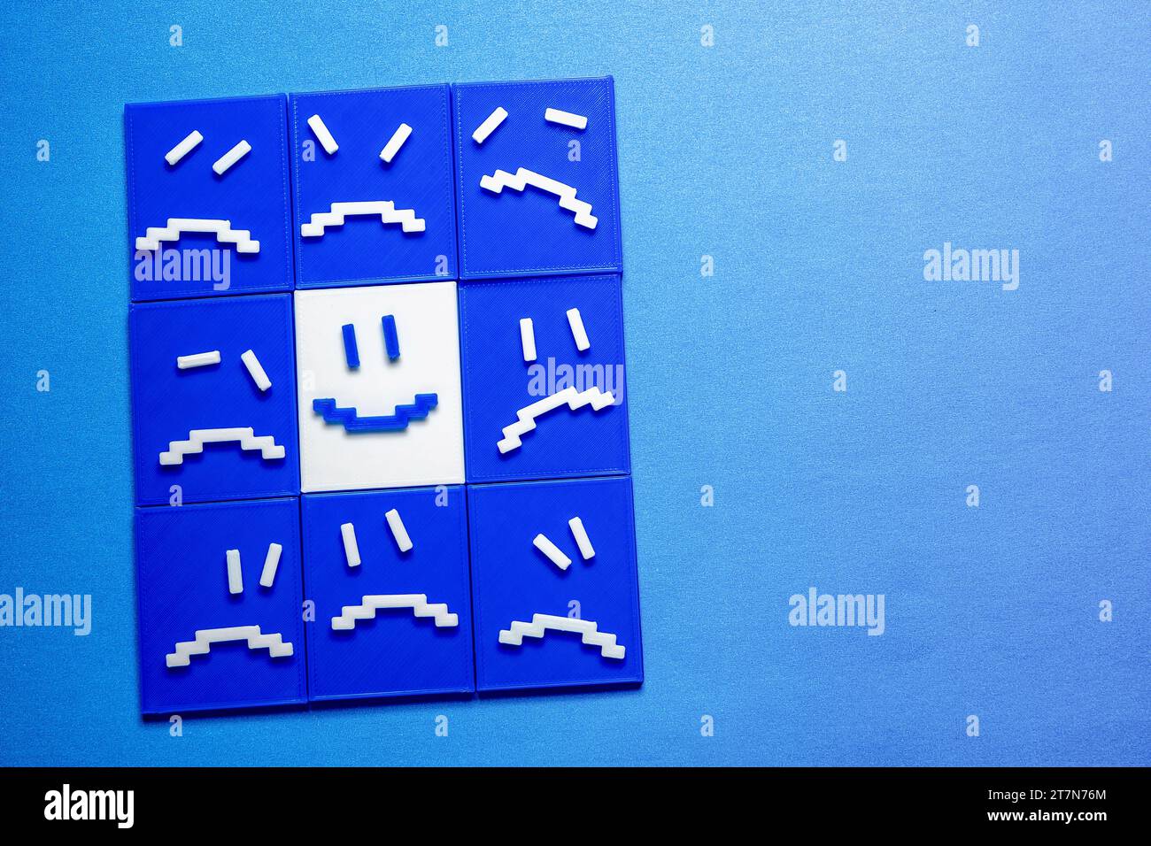 Concept of a happy face around sad and angry faces Stock Photo - Alamy