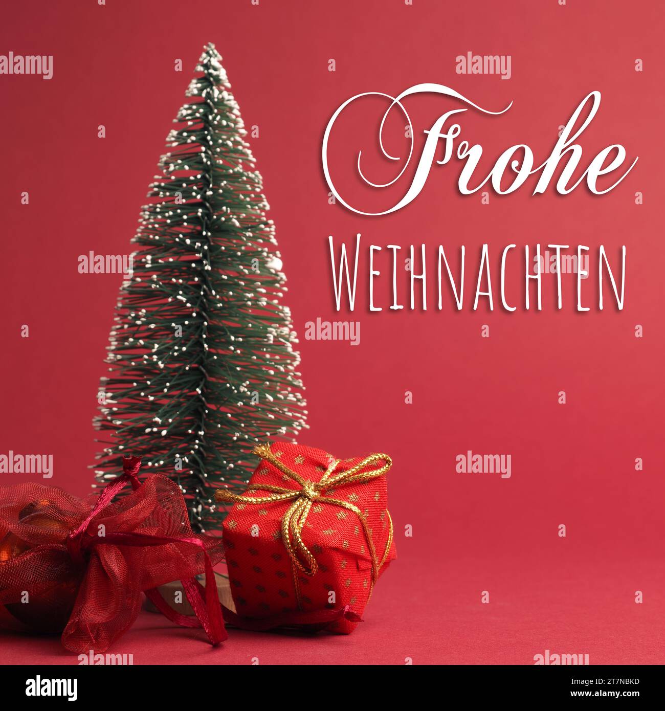 German Merry Christmas Text with red Christmas gift box and decoration ...
