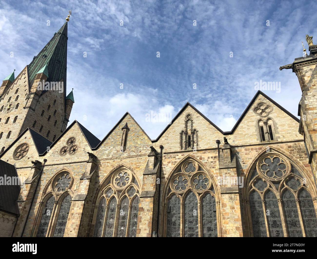 This stock photo shows a grand historic church, featuring tall stained ...