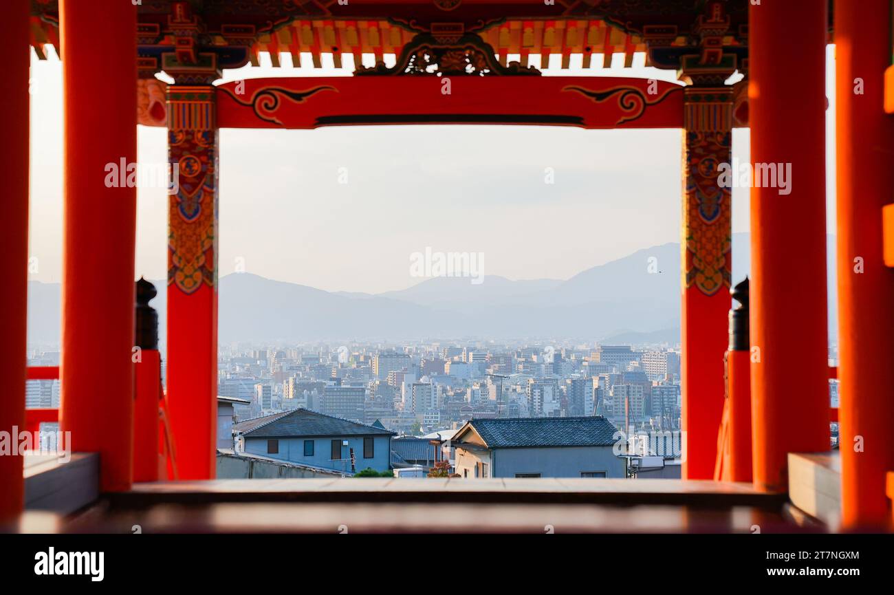 An aerial view of a skyline seen through the window of a traditional ...