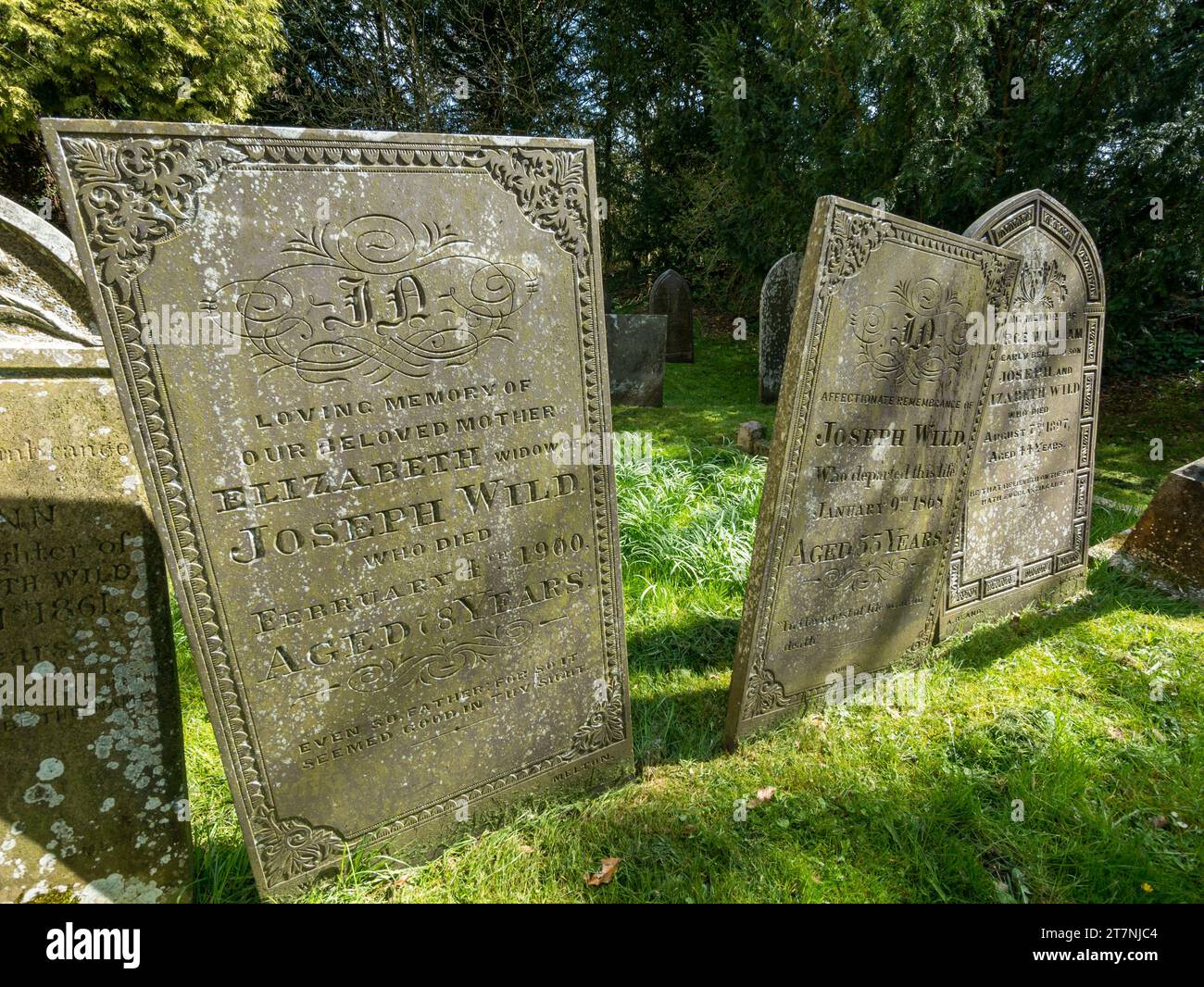 Old slate headstones with ornate carved lettering inscriptions, Little ...