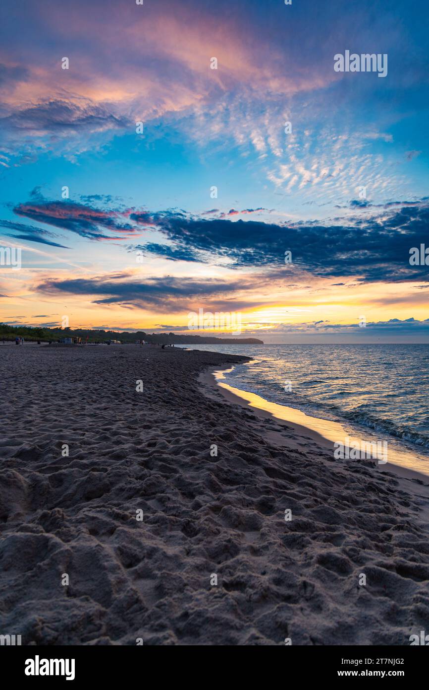Beautiful dark golden sunset at golden hour at the beach next to dark ...