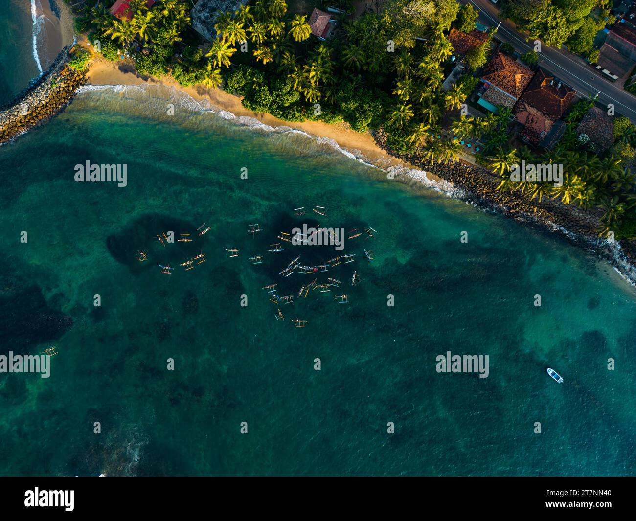 Top view of multiple oruwa outrigged canoe boats fishing in clear ...