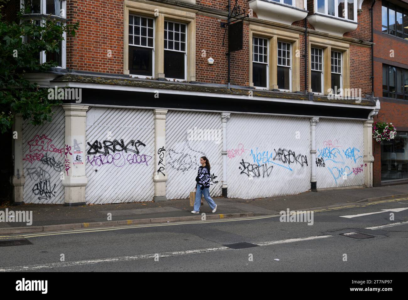Graffiti boarded up windows walking hi-res stock photography and images ...