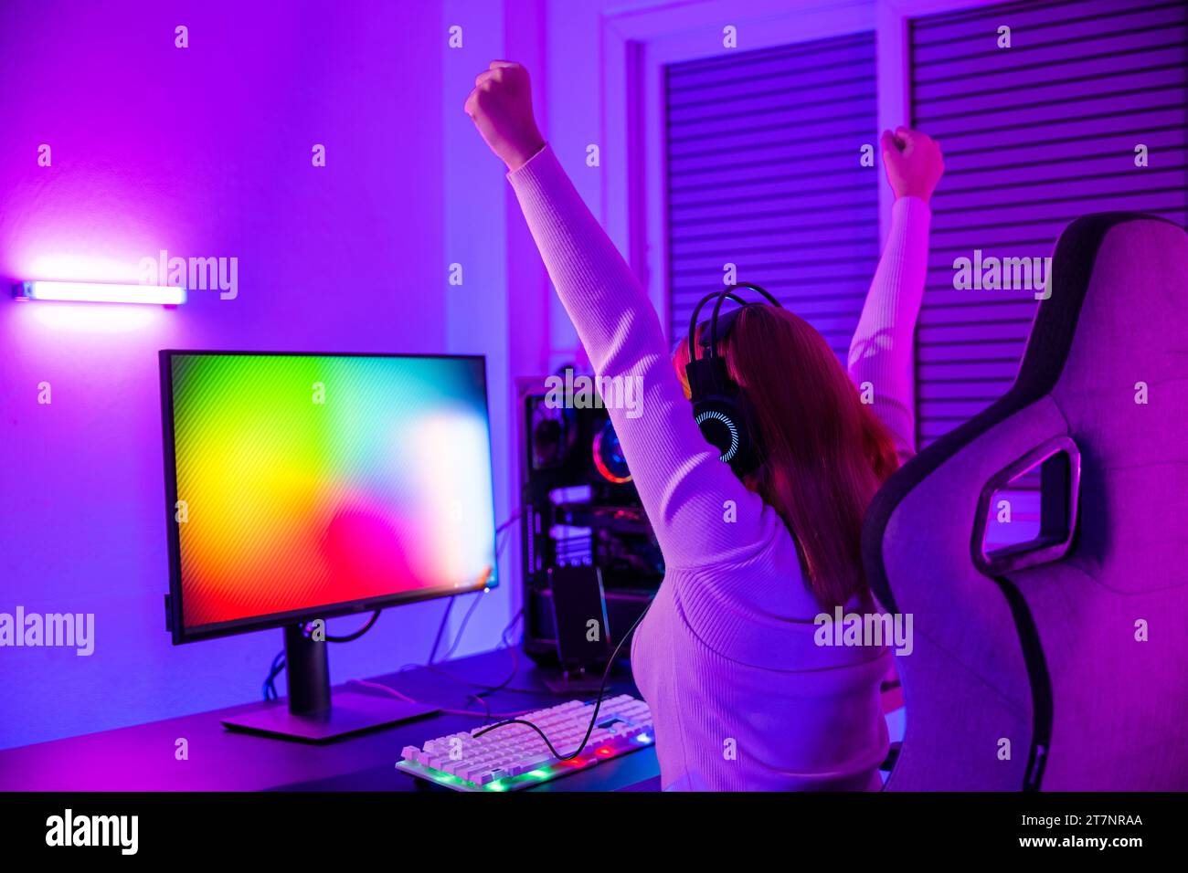 Asian gamer playing online video game excited on desktop computer Stock ...