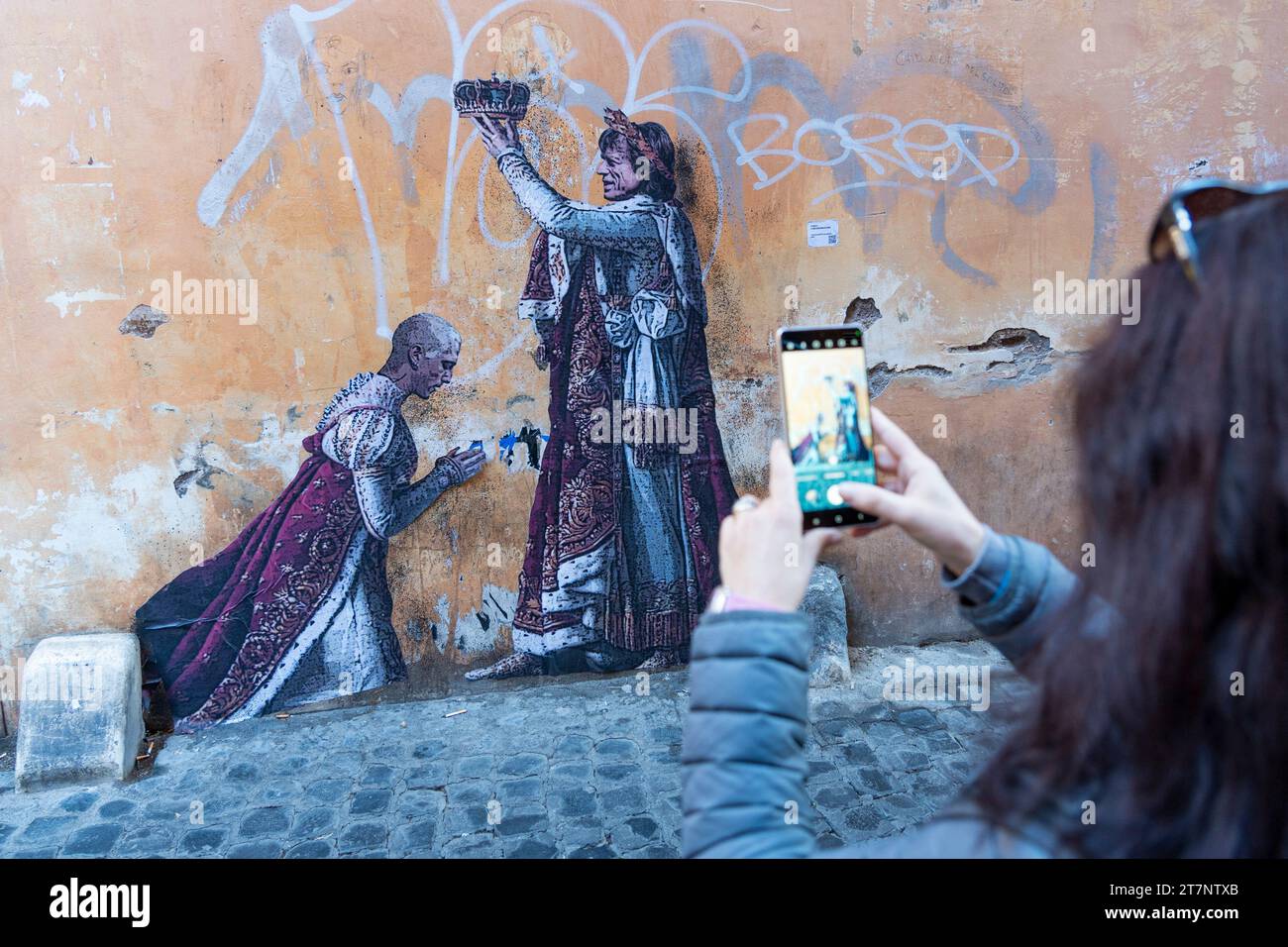 Rome, Italy. 13th Nov, 2023. A tourist takes photos of Mick Jagger ...
