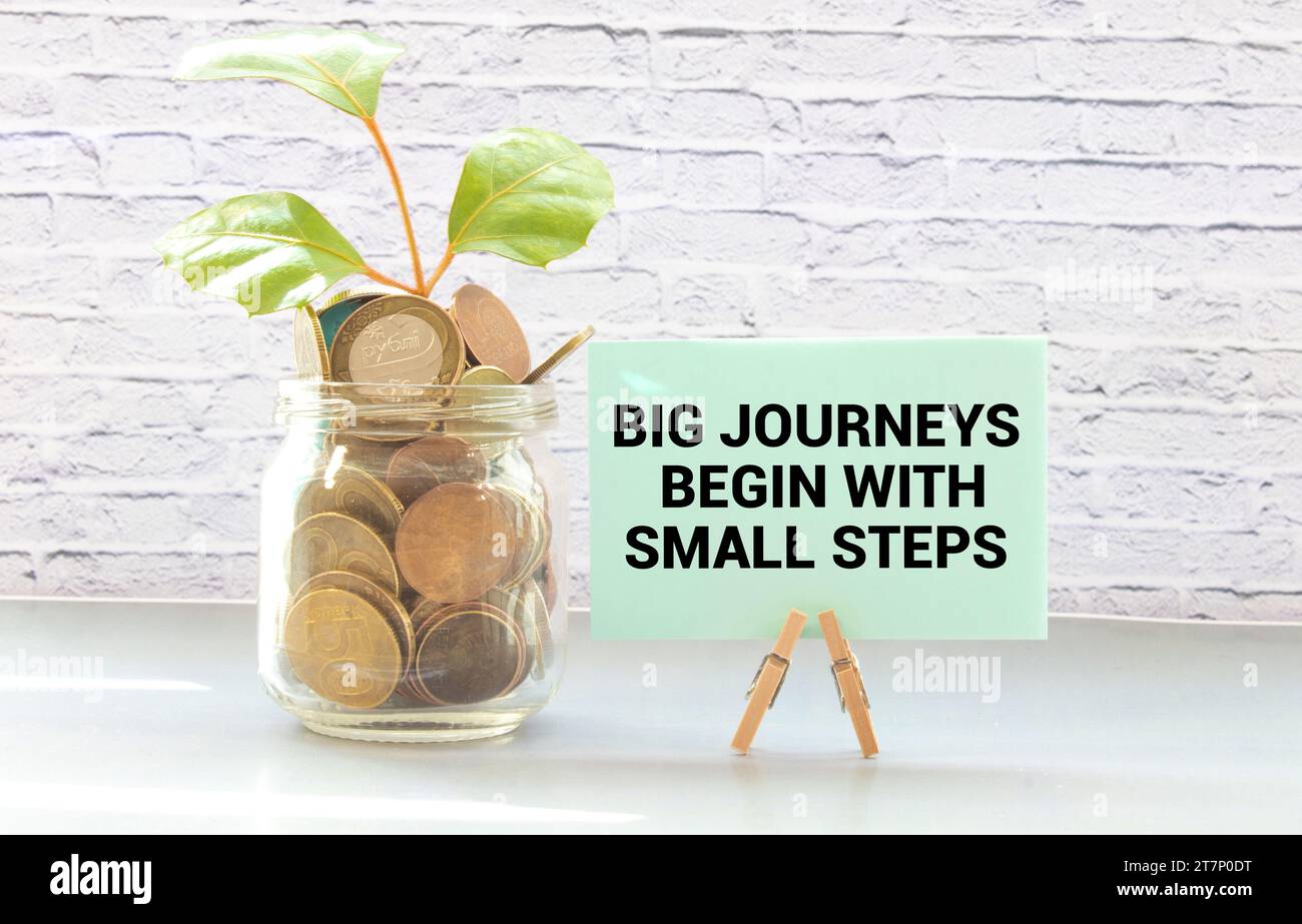Text big journeys begin with small steps on note paper Stock Photo - Alamy