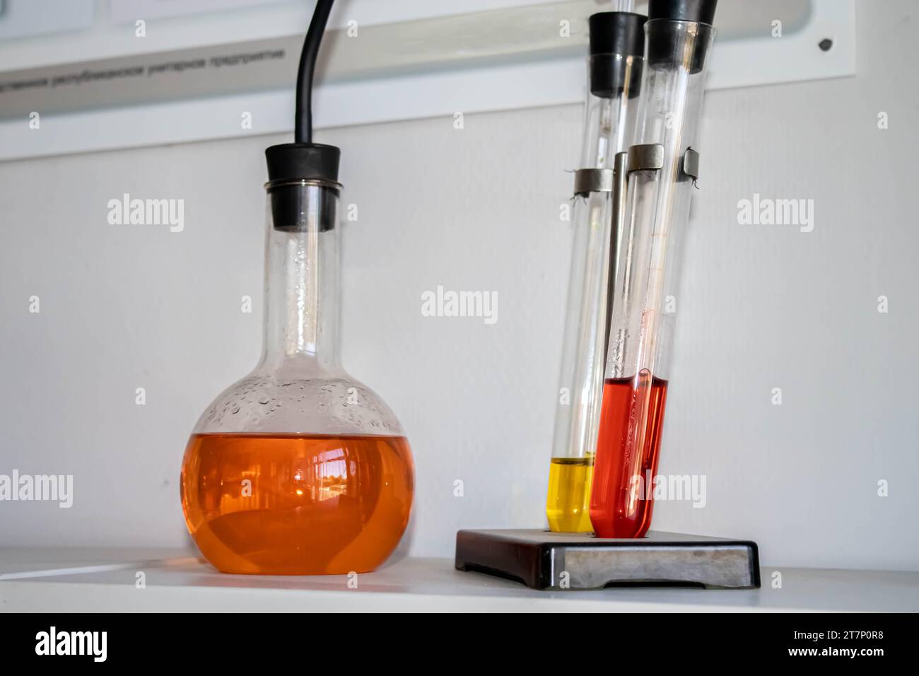 Chemists are measuring the temperature of the solution in a test tube ...