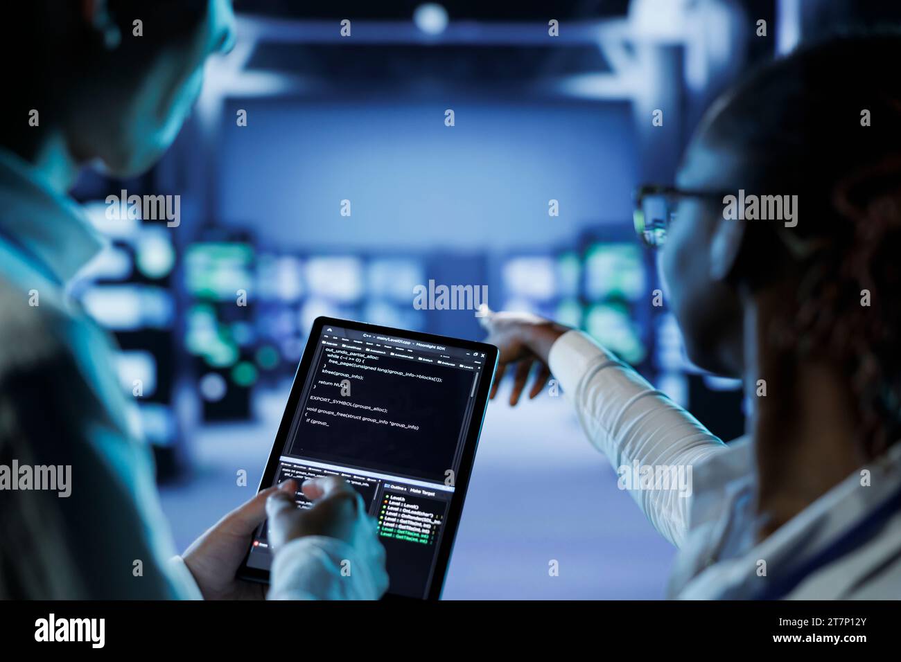 Qualified technicians building firewall systems in server room housing ...