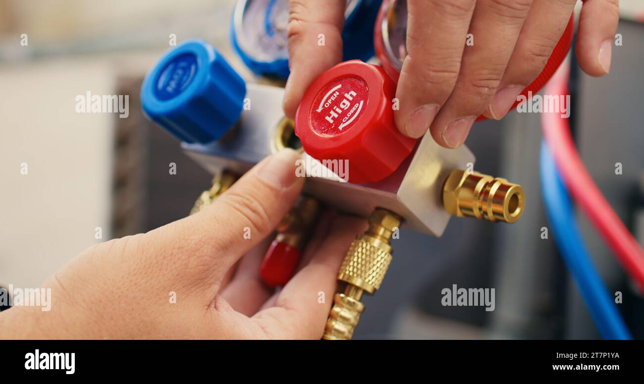 Adept repairman calibrating pressure hi-res stock photography and ...