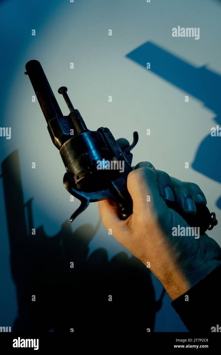 Pistol gun artistic photograph book cover design Stock Photo - Alamy