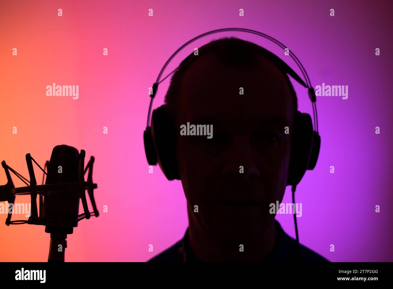 Voiceover artist voice actor in vocal recording studio with larg ...