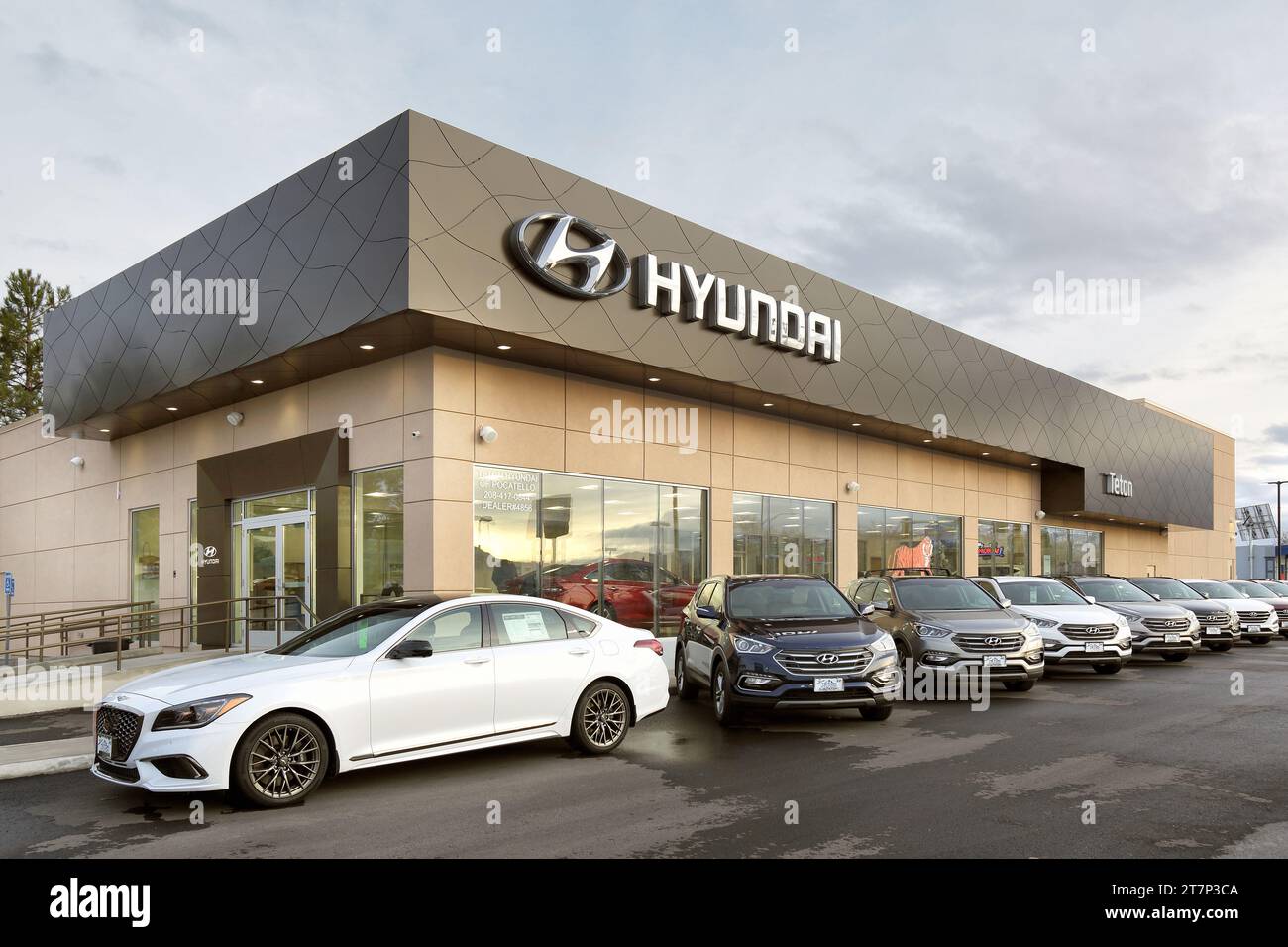 The Hyundai logo, on the outside of a Hyundai car dealership, with new ...
