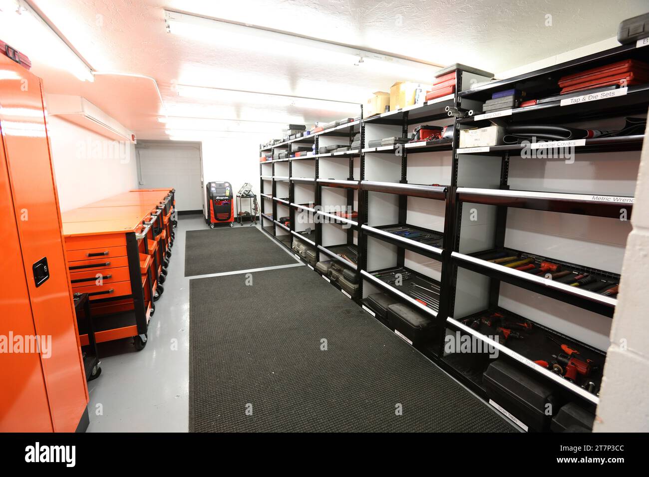 Heavy duty shelves and tool boxes in the tool room of a high school ...