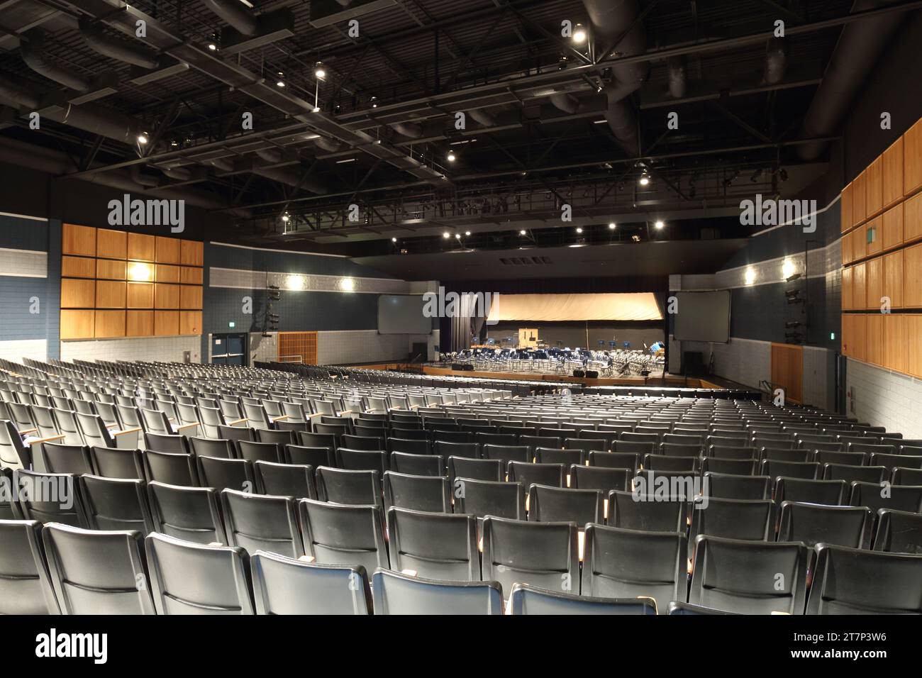 A modern theater in a high school with accoustical panels, stage ...